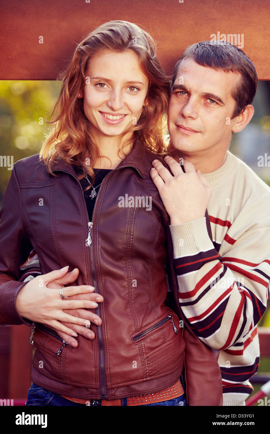 couple stand side by side and looking at the camera Stock Photo - Alamy