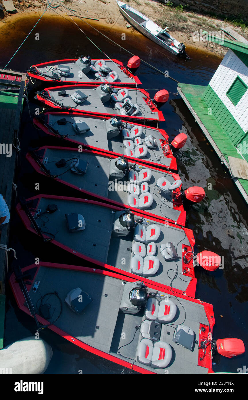 Modern bass boats are used by some Amazon River fishing outfitters that ...