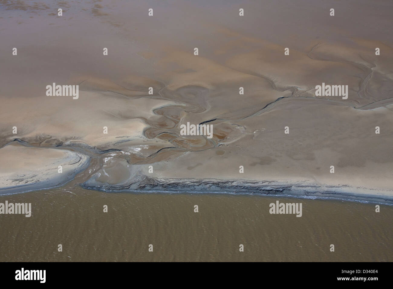 Aerial view over tidal mudflats of the Wadden Sea National Park, North ...