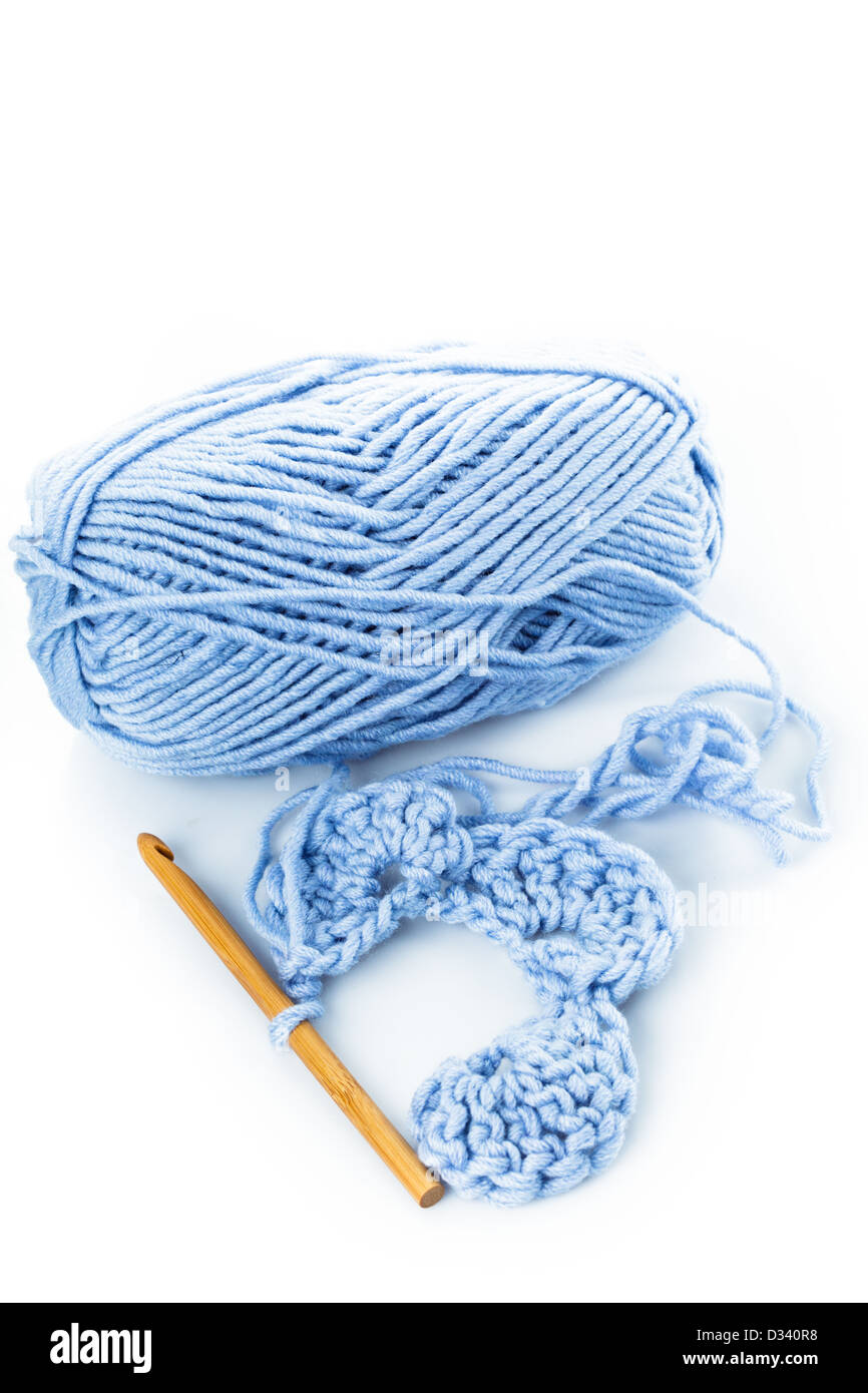 Crocheting with blue threads isolated on white Stock Photo - Alamy