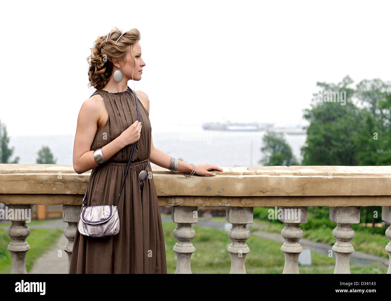Beautiful girl on the balcony Stock Photo - Alamy