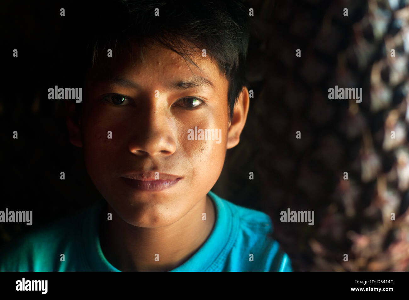 A Matses Mayorunas boy inside a maloca (traditional house), Amazonian ...