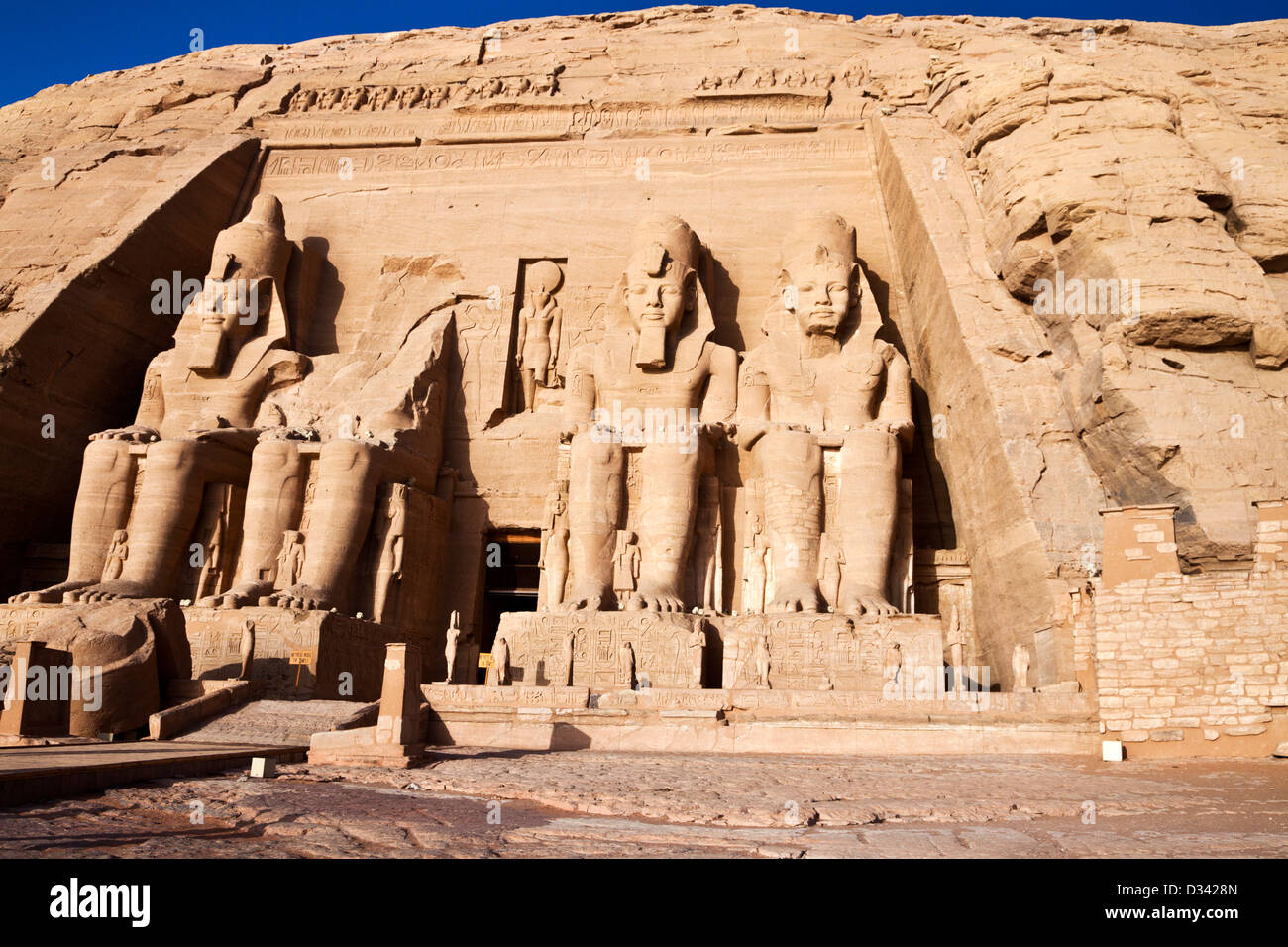 Statues of pharaoh Ramesses II on the outer facade of the Great Temple ...