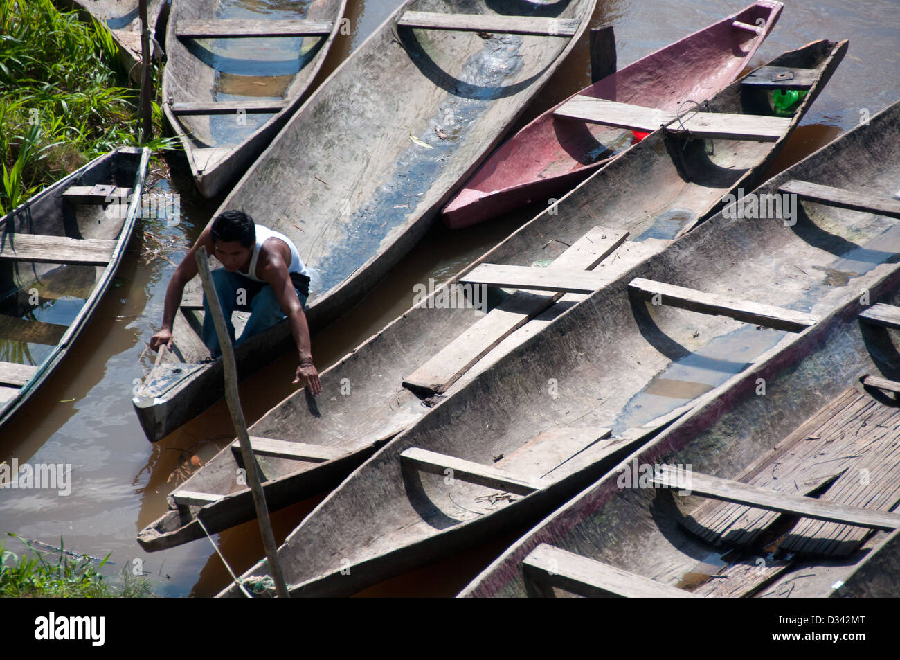 Canoes at Colonia Angamos harbor on Javari River, Amazonian Peru Stock ...