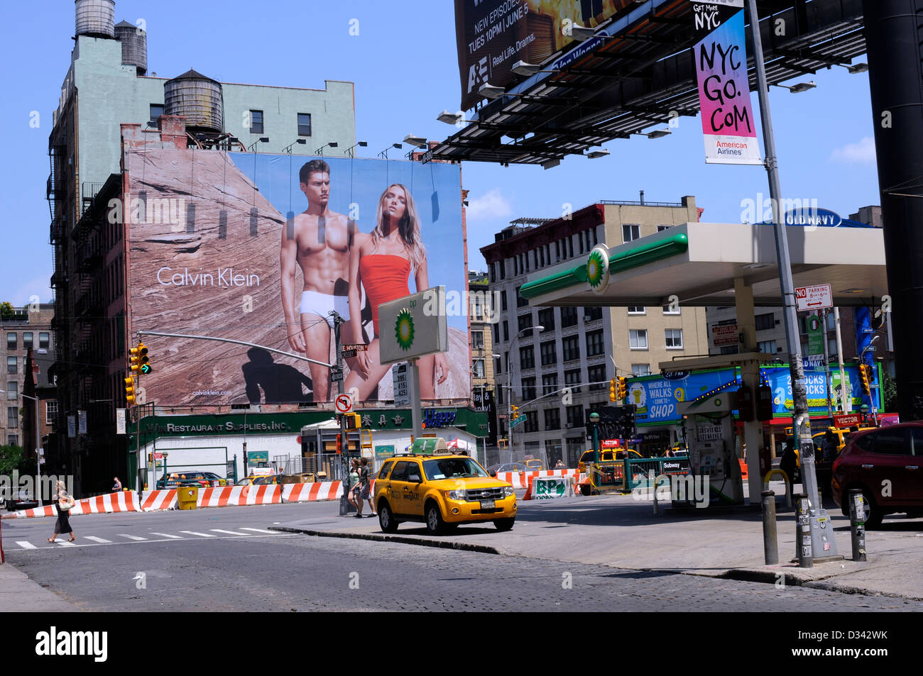 street architecture, traffic, pedestrians and enormous advertising ...