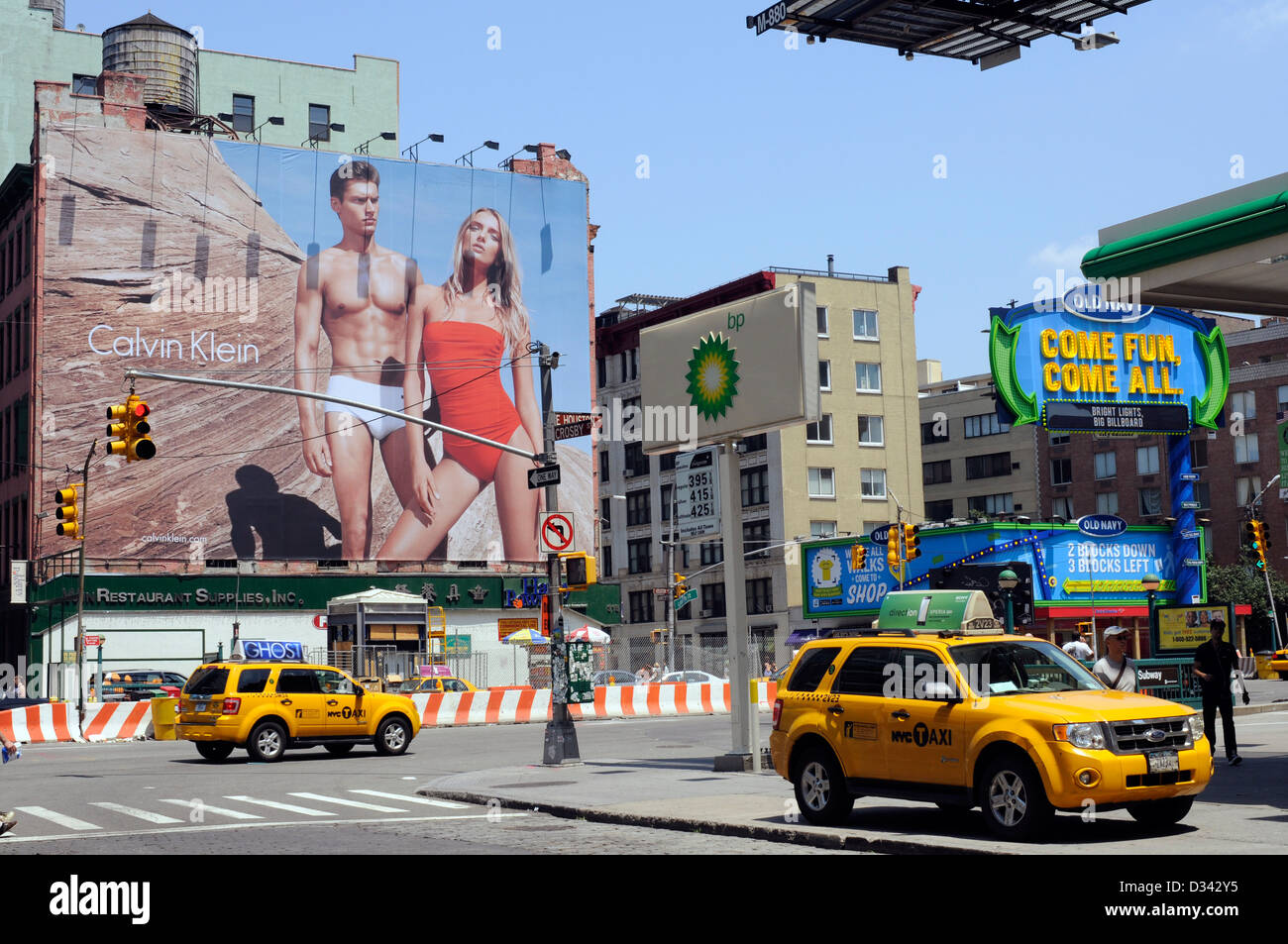 street architecture, traffic, pedestrians and enormous advertising ...