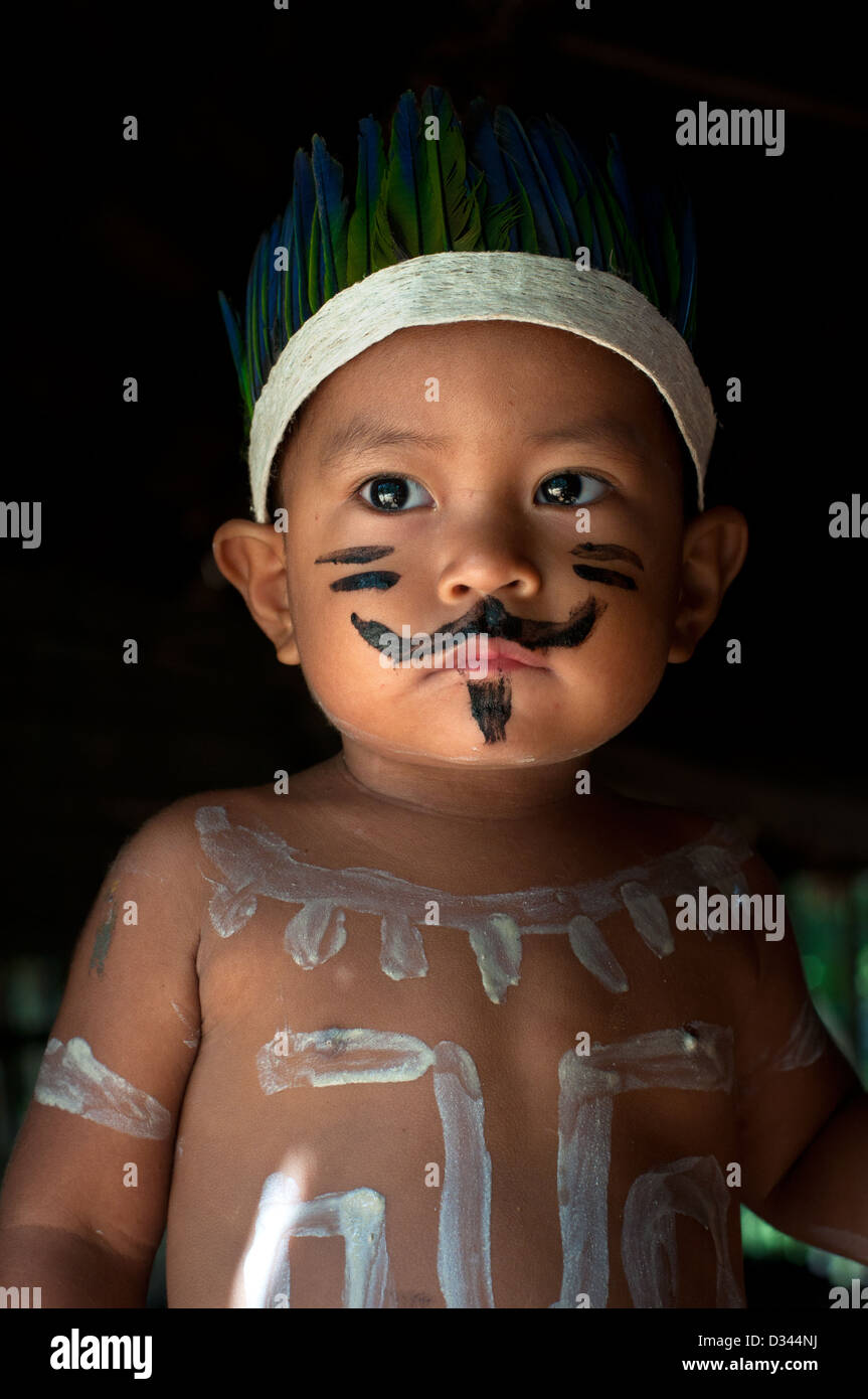 A Bora child with traditional headdress and body painting, Puca ...