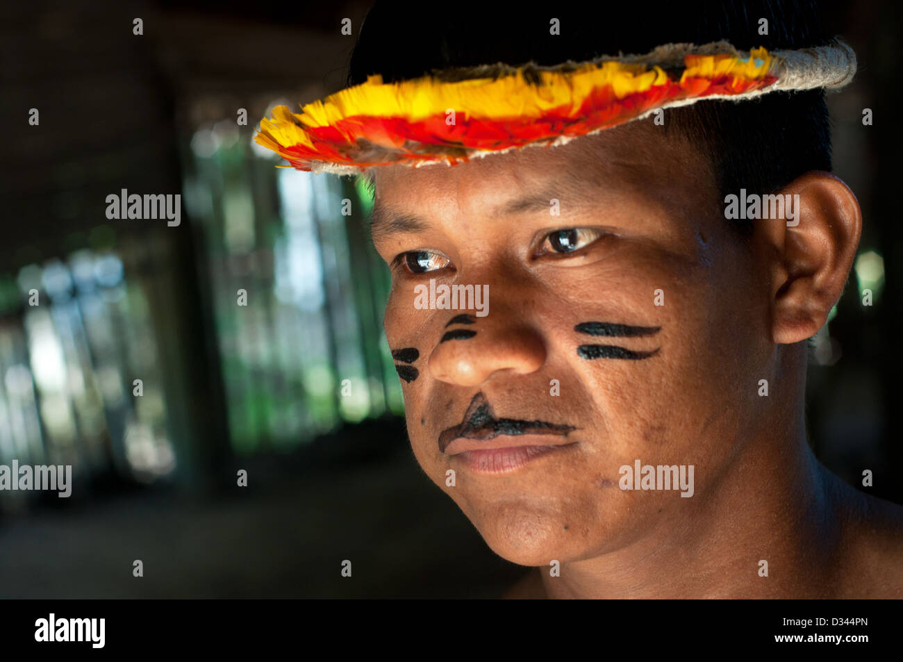 A Bora adult man with traditional headdress and body painting, Puca ...