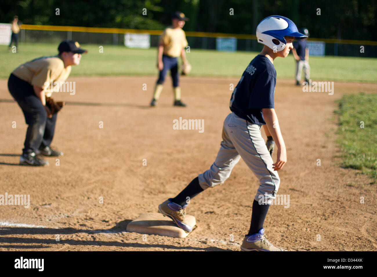 Young boy playing baseball Stock Photo - Alamy