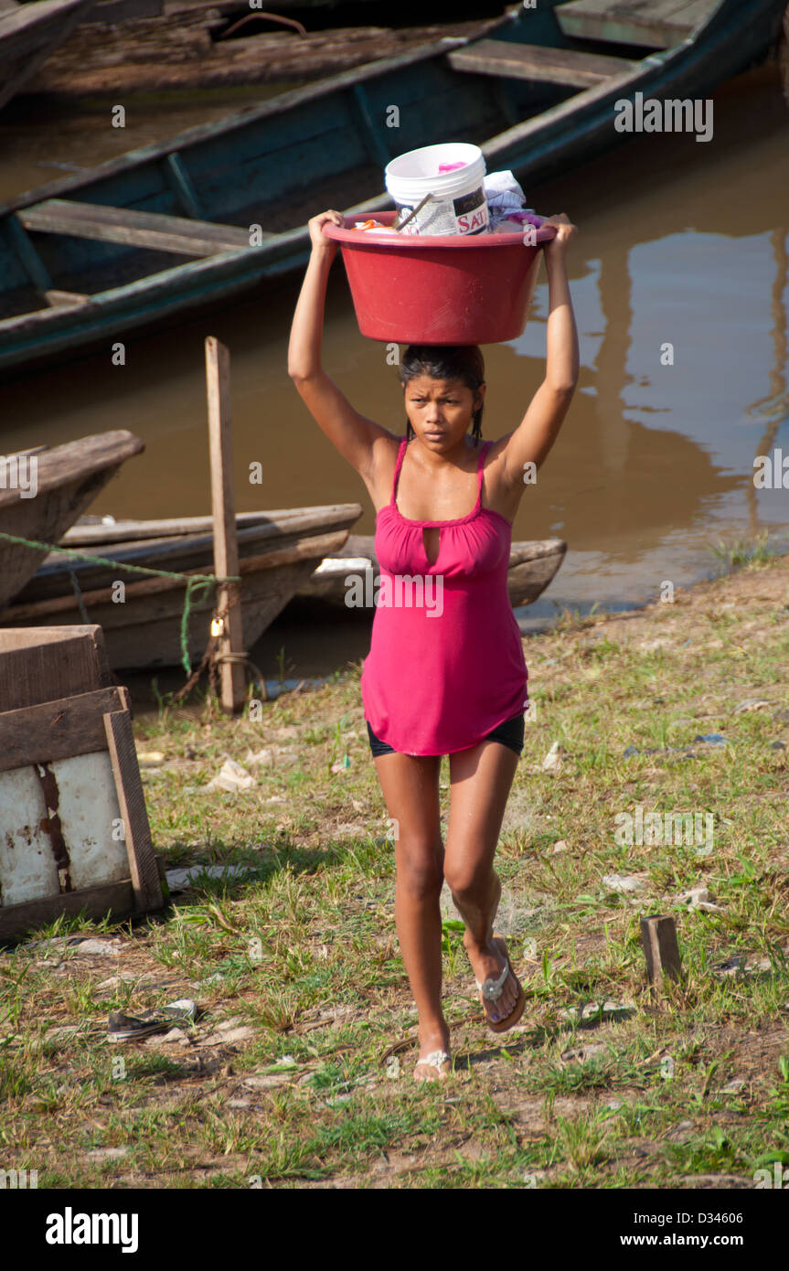 A girl coming back from the Amazon river after washing, Pevas ...