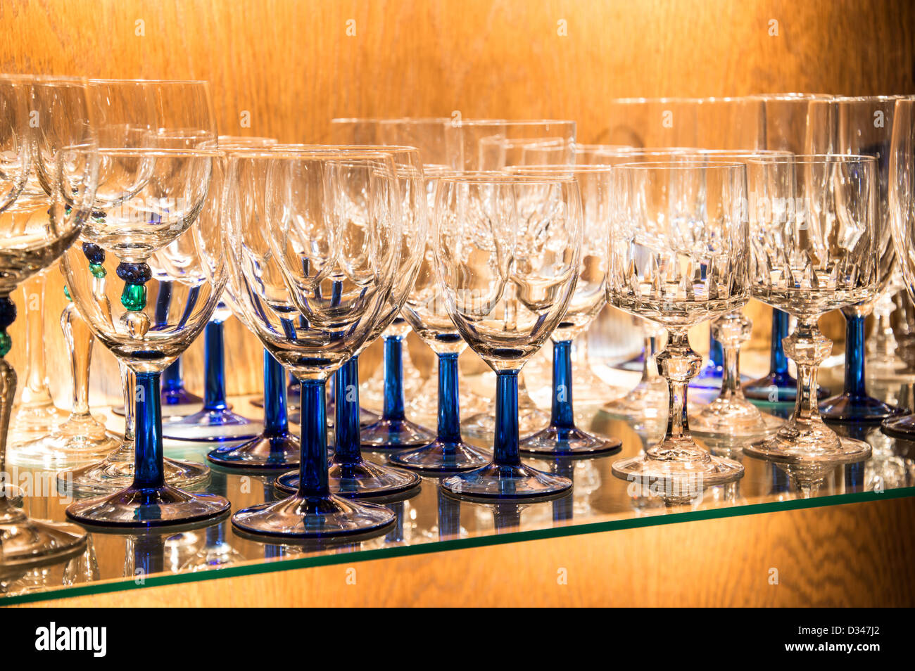Glassware in a Bar on wooden background Stock Photo - Alamy