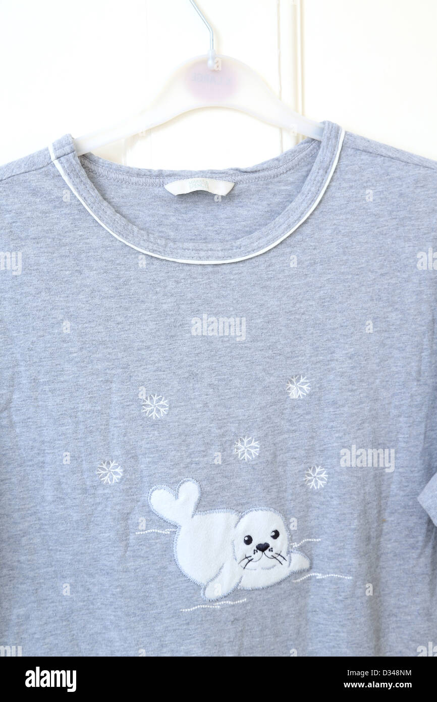 Pale Blue Night Shirt With Picture Of A Seal Stock Photo - Alamy