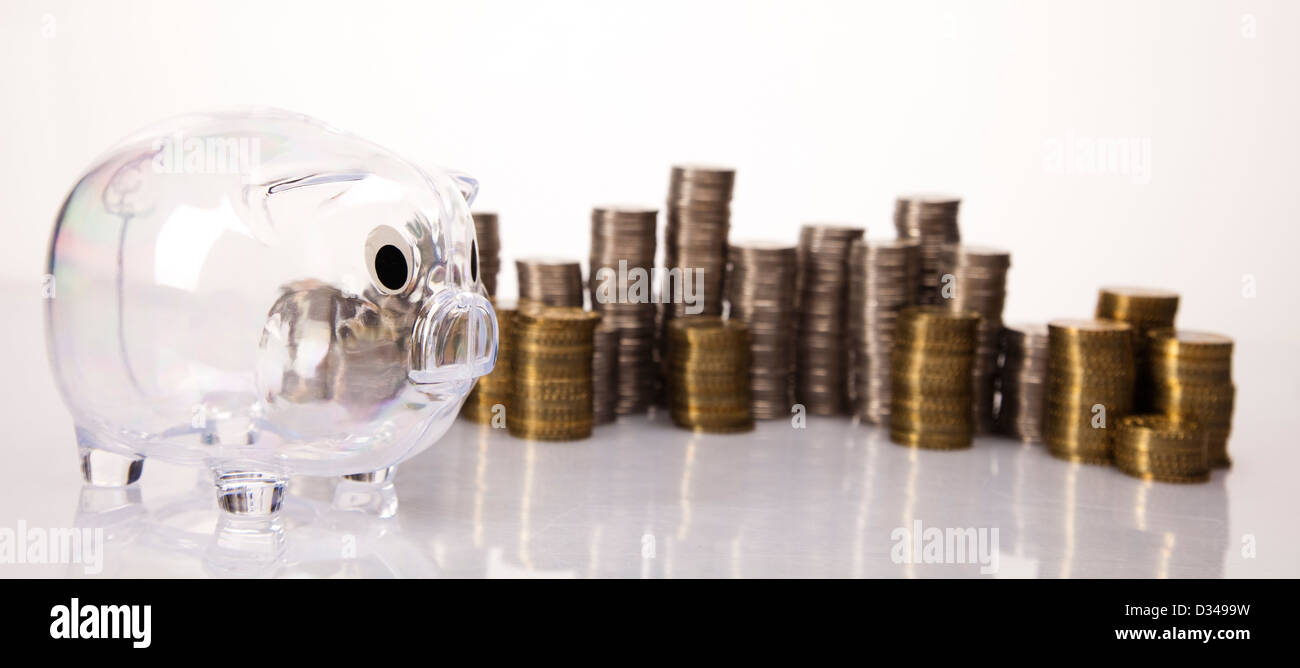 Pig bank and money coin Stock Photo - Alamy