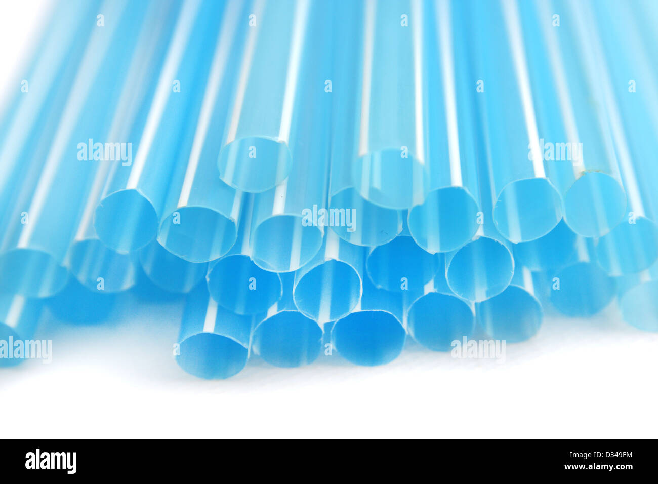 Blue plastic straws Stock Photo - Alamy