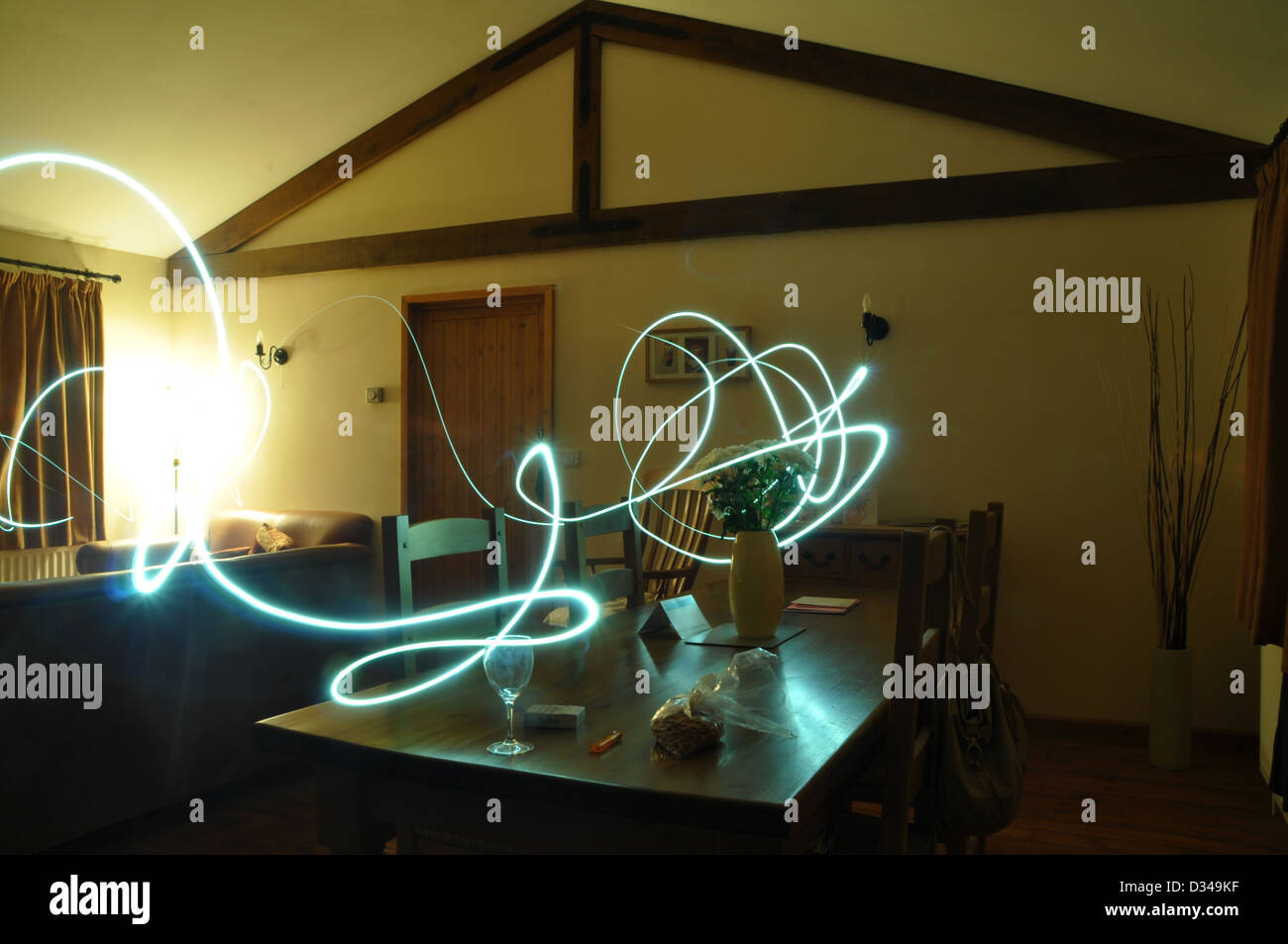 Long exposure lights in a log cabin holiday home Stock Photo - Alamy