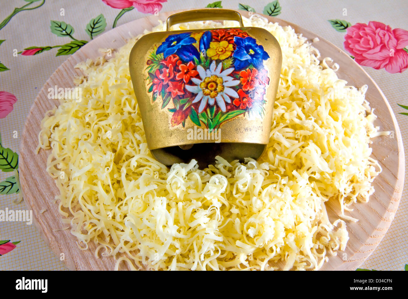 Bavarian grated cheese with cowbell Stock Photo - Alamy