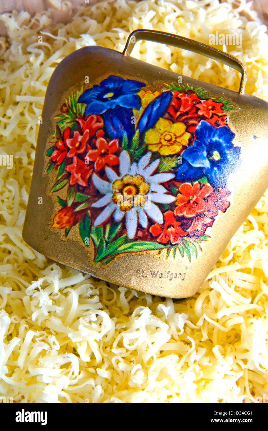 Bavarian grated cheese with cowbell Stock Photo - Alamy
