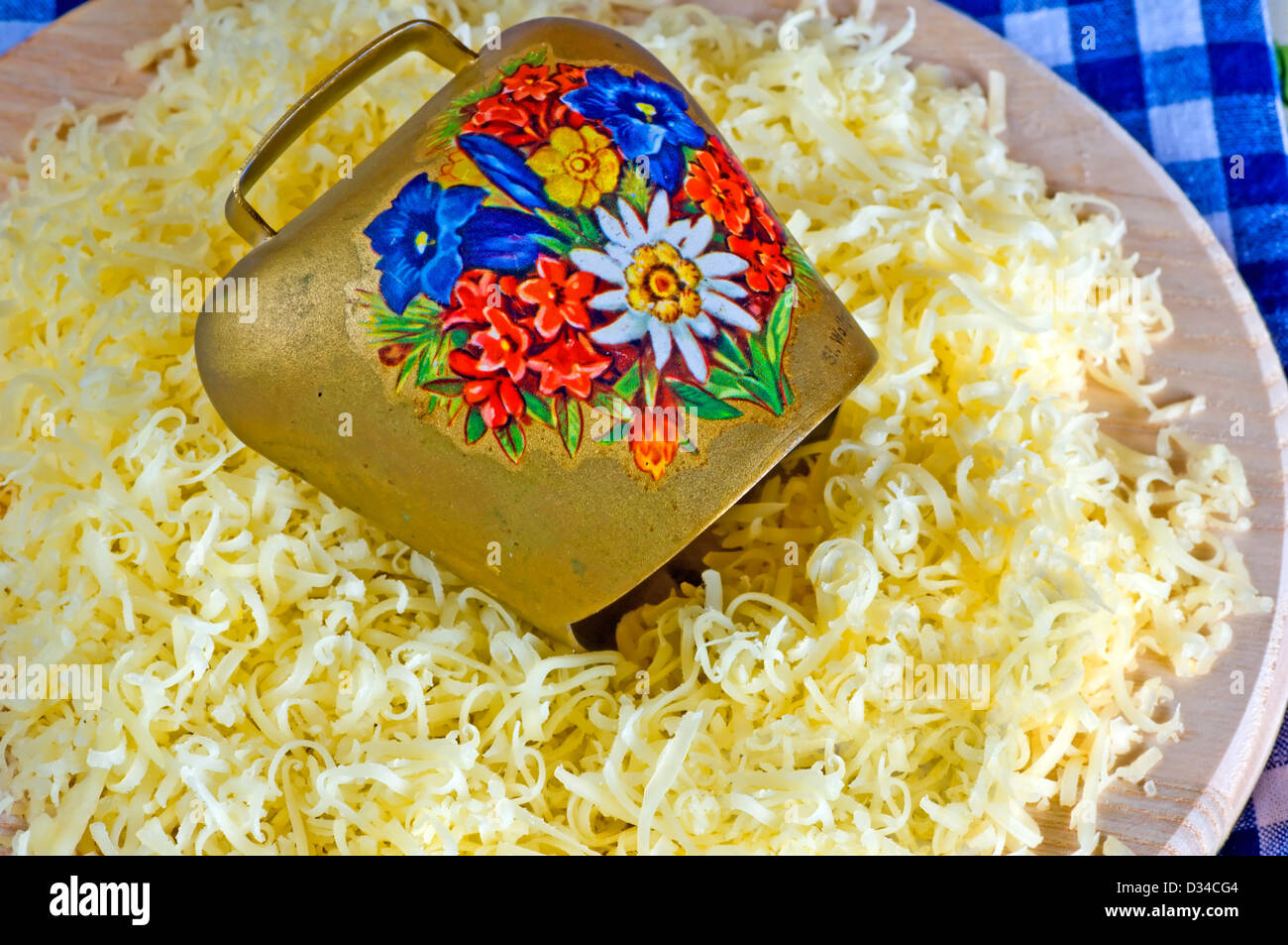 Bavarian grated cheese with cowbell Stock Photo - Alamy
