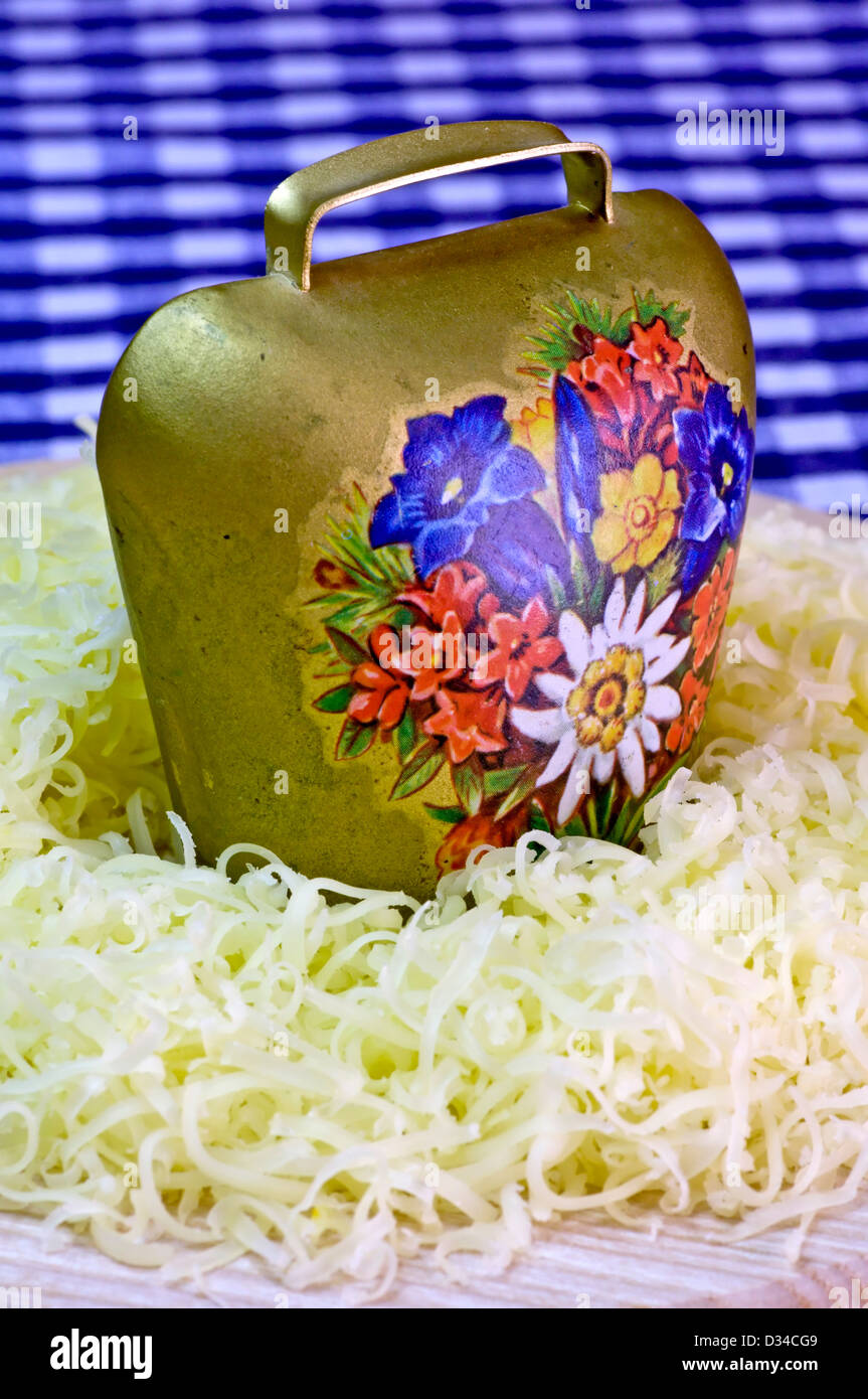 Bavarian grated cheese with cowbell Stock Photo - Alamy