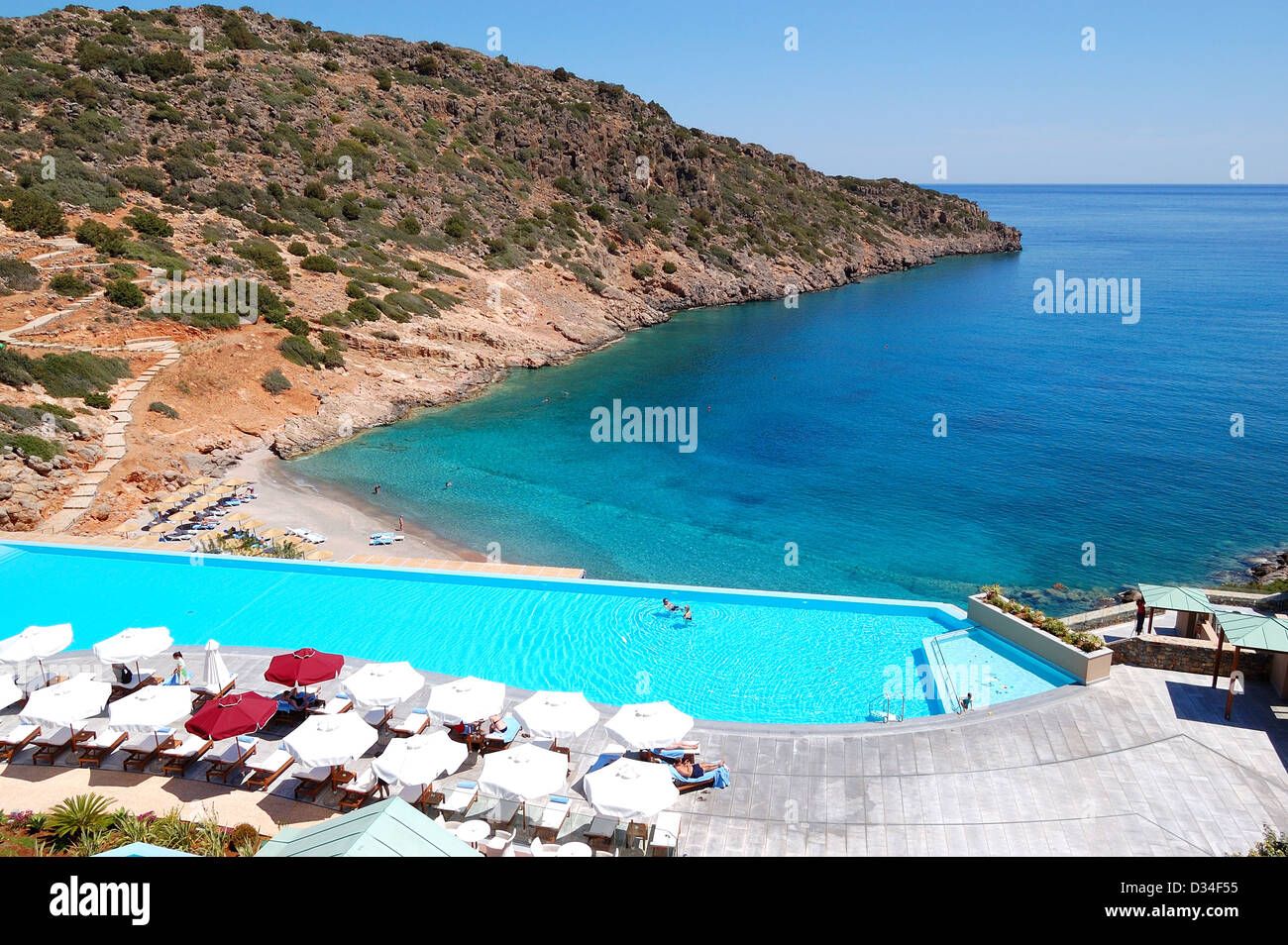Swimming pool with a view on beach at the luxury hotel, Crete, Greece ...