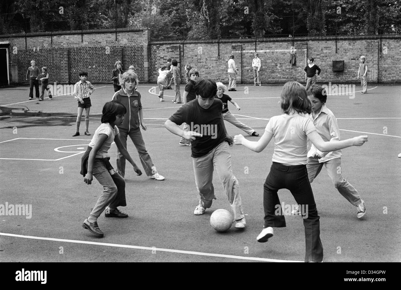 School children playing football Black and White Stock Photos & Images ...