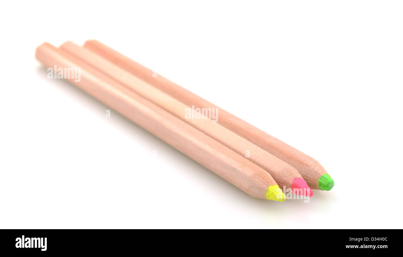 Three colored pencils on white background Stock Photo - Alamy