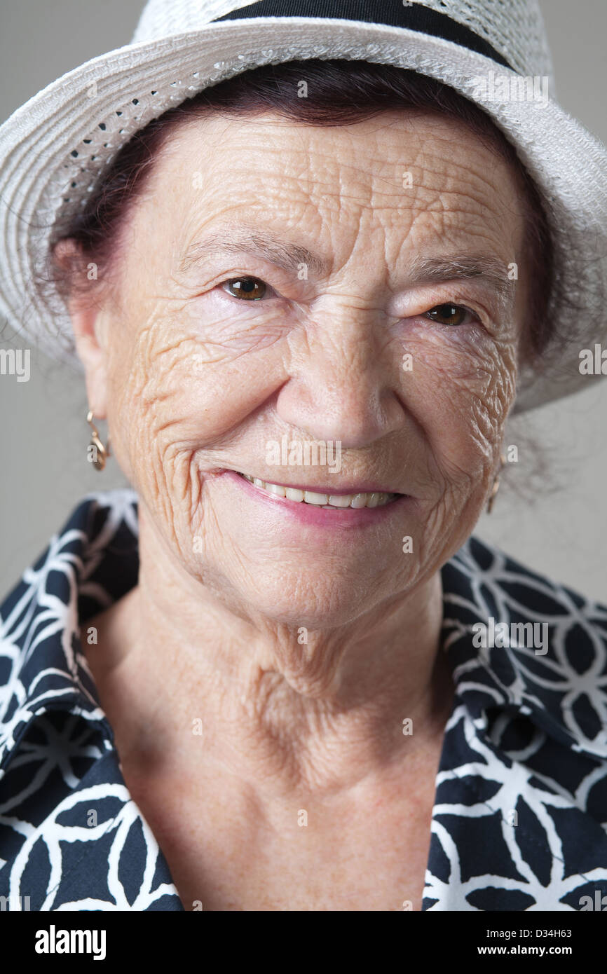 Portrait of a beautiful retired happy senior woman Stock Photo - Alamy