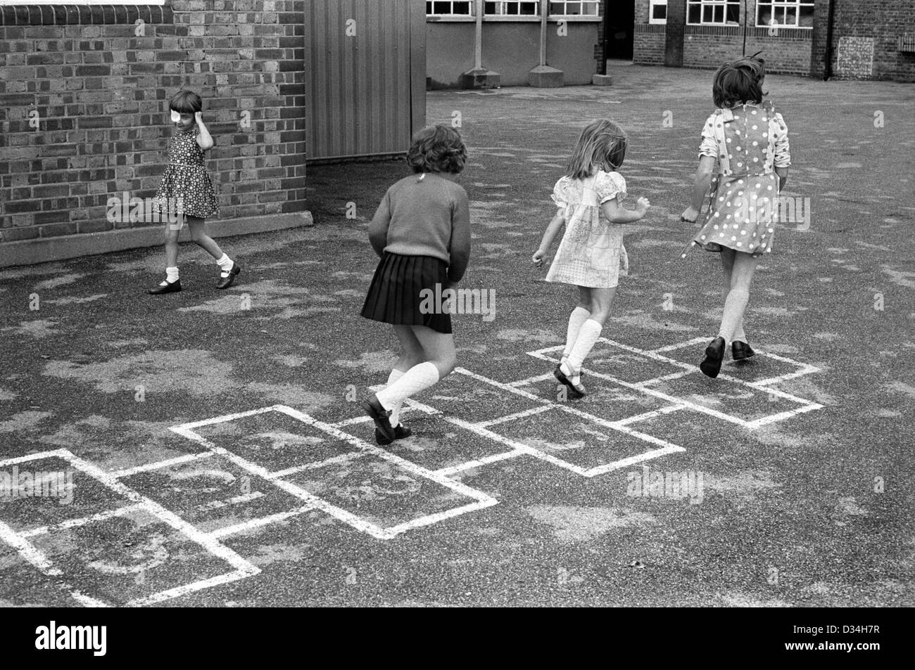 Primary school playground Hopscotch hop scotch. Girls playing together ...
