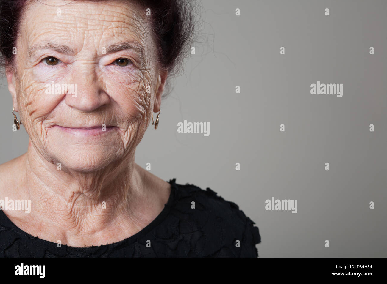 Portrait of a beautiful retired happy senior woman Stock Photo - Alamy