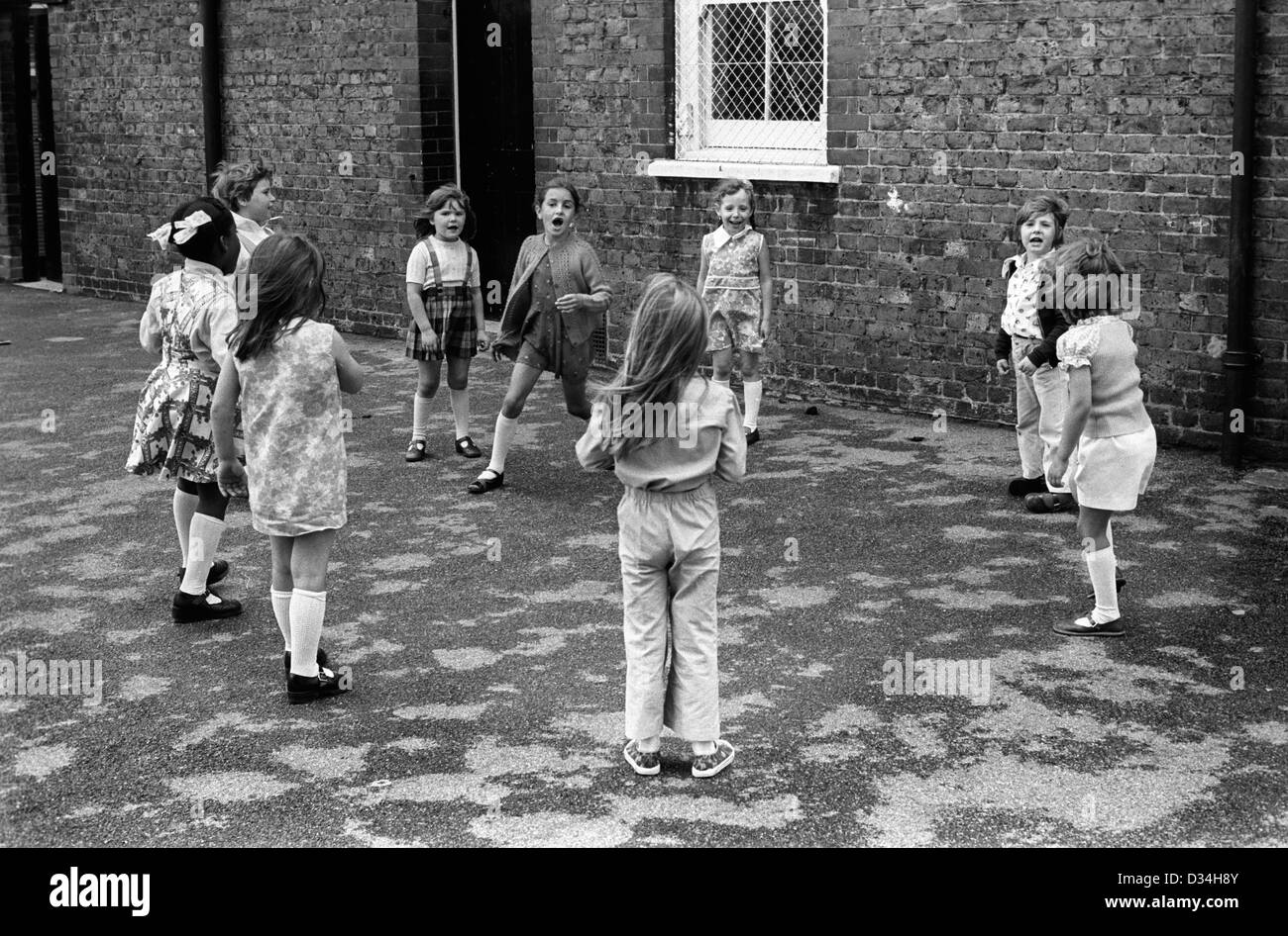 Primary school playground. Girls playing together. South London. 1970s ...