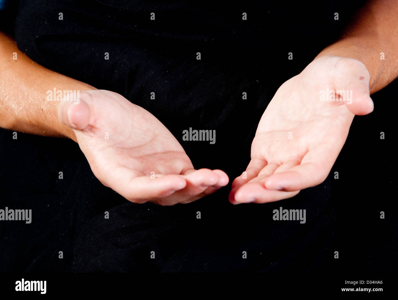 White man's hands open to receive double hand-fulls Stock Photo - Alamy