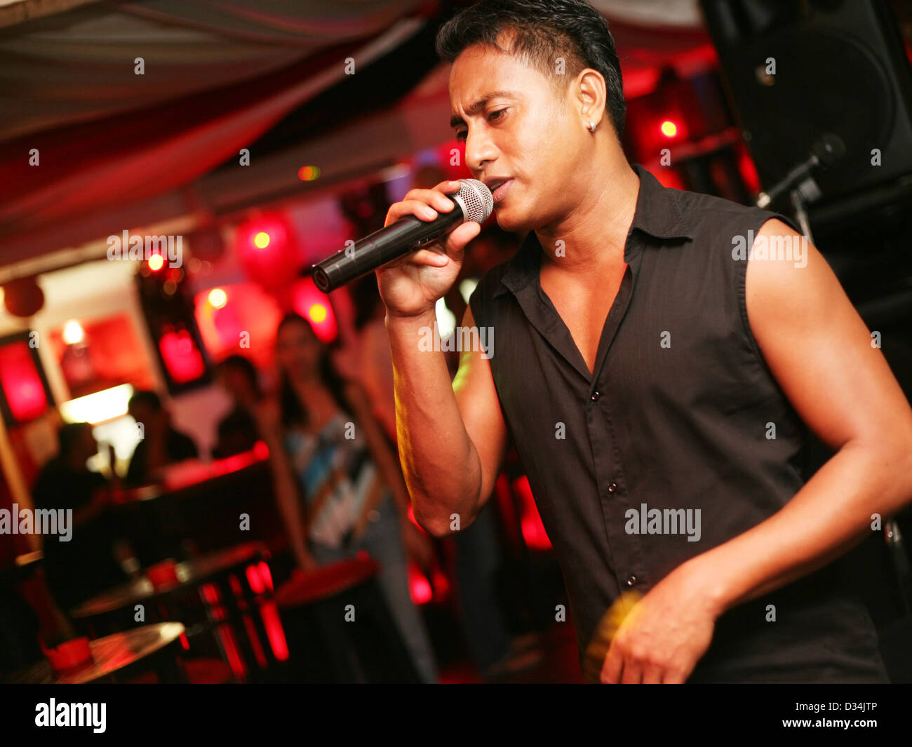 Singer at an alive concert in a night club "La vida loka". Bali ...