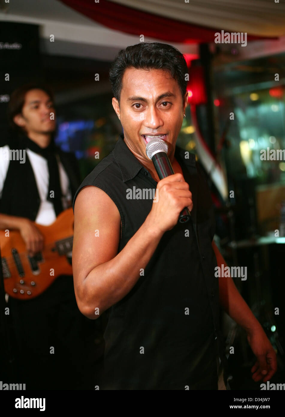 Singer at an alive concert in a night club "La vida loka". Bali ...