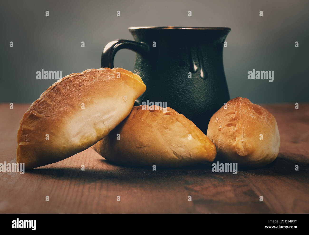 pierogi .Home cake with jam against the wooden table Stock Photo - Alamy