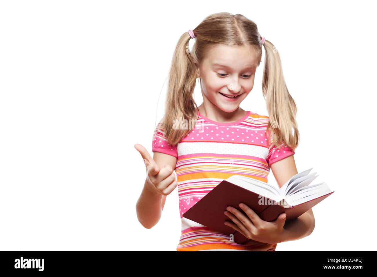 Small funny girl reading a book on white background Stock Photo - Alamy