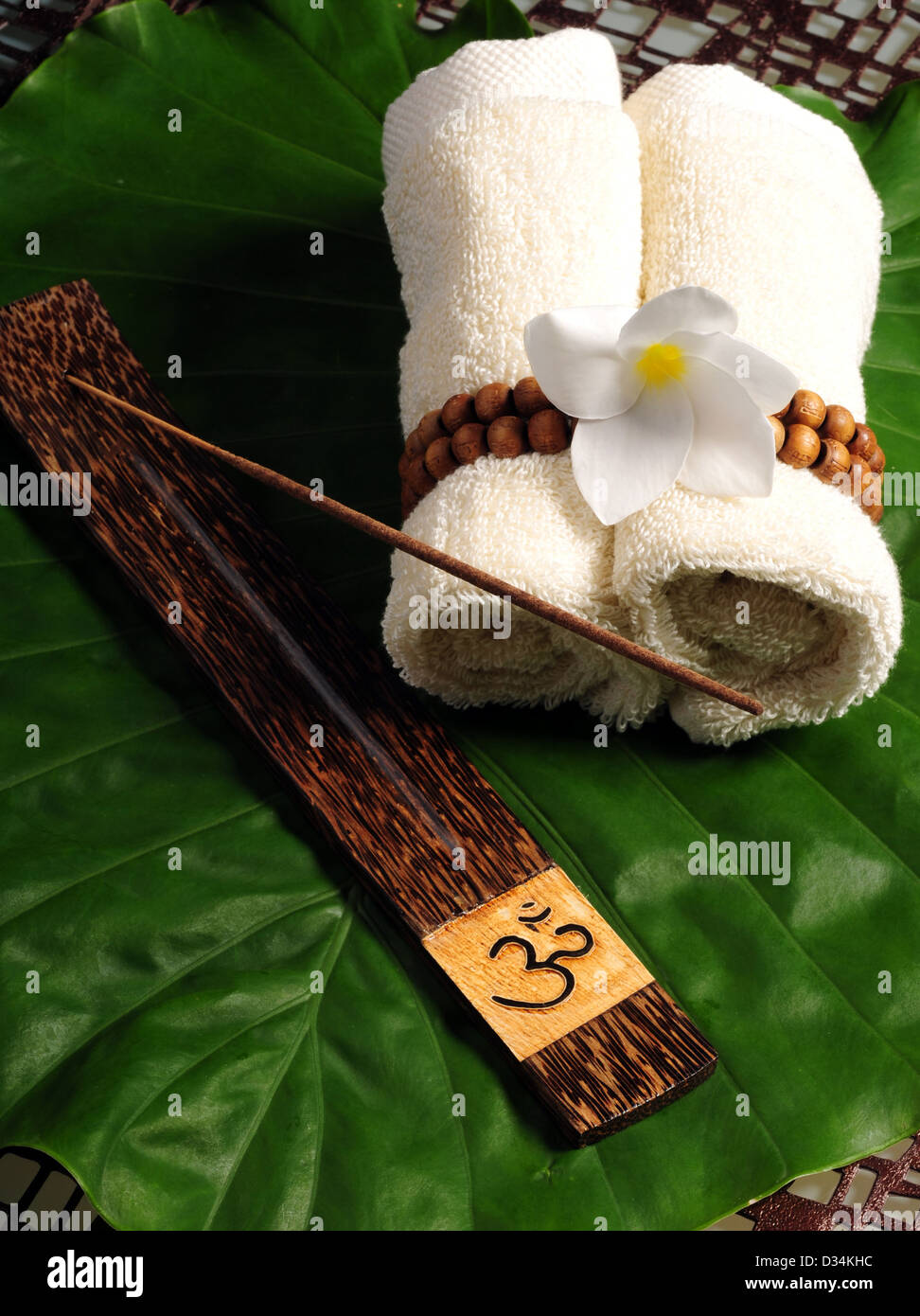 Eastern spa setting with incense and flower Stock Photo - Alamy