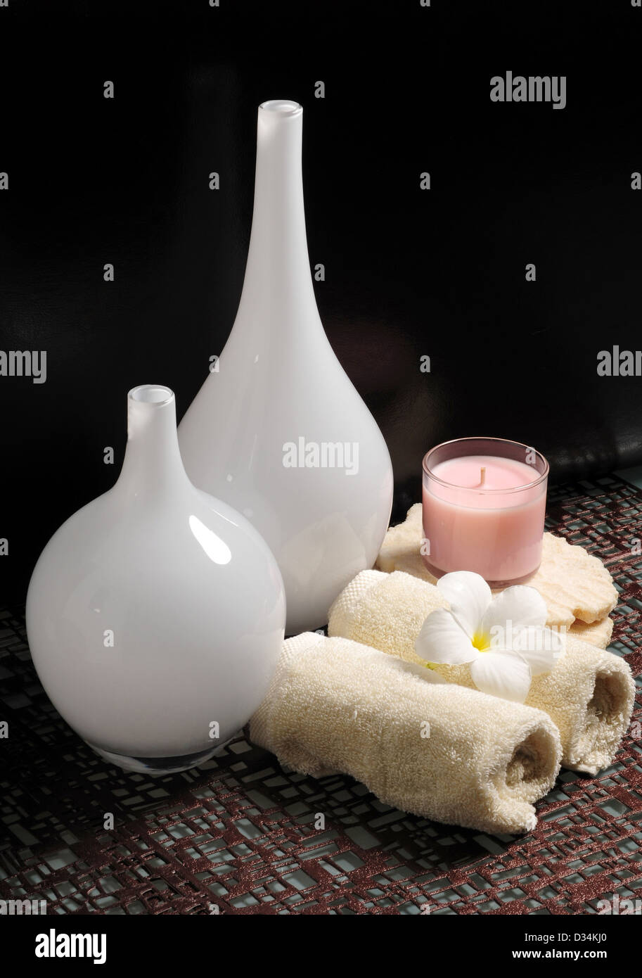 An arrangement of items used at a day spa for a relaxing experience ...