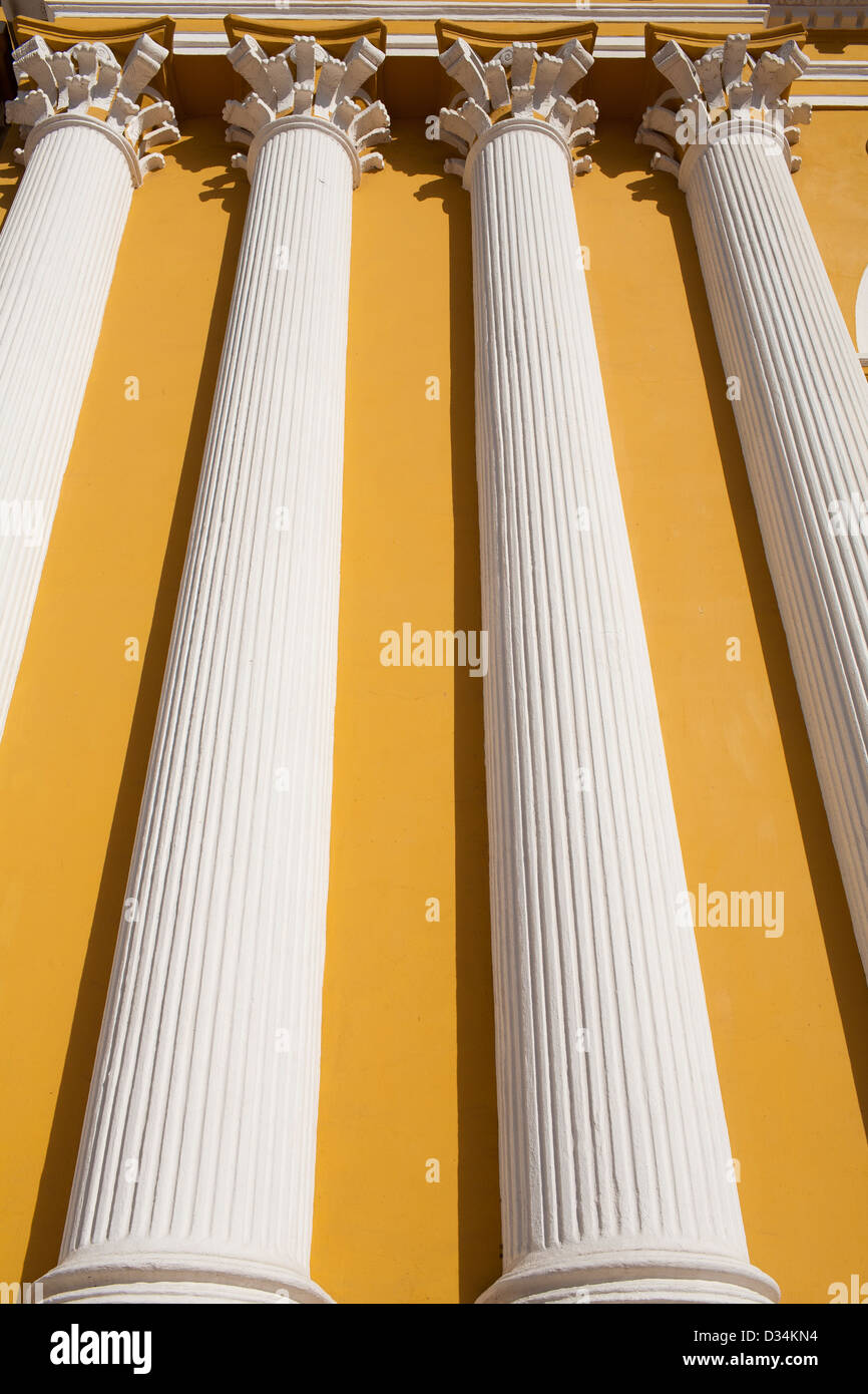 Columns and a bright yellow facade, an architectural detail of the ...