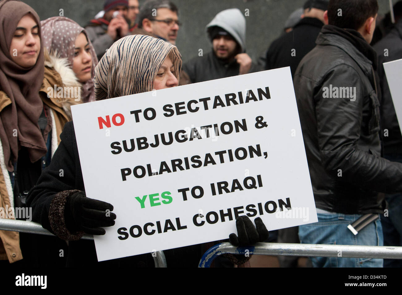 London, UK. 9th February 2013. Iraqi woman holds placard reading 'No to ...