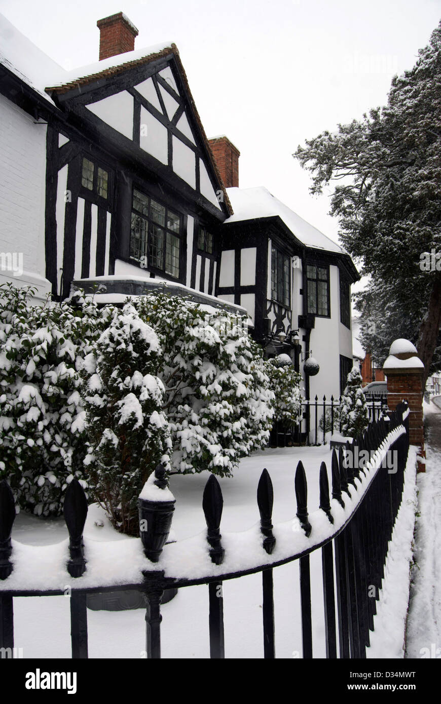 View of a snowy house and railings Stock Photo - Alamy