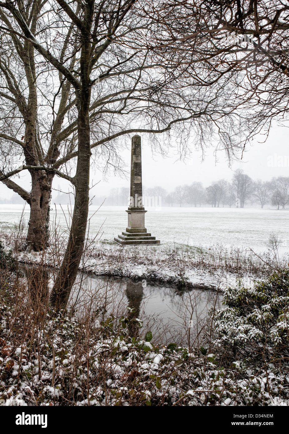 Obelisk, trees, canal and a snow covered Old Deer Park in cold winter ...
