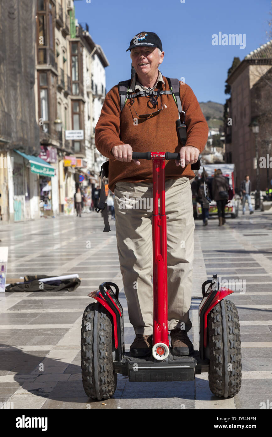 Senior man on Segway in Plaza Nueva Granada Spain Stock Photo - Alamy