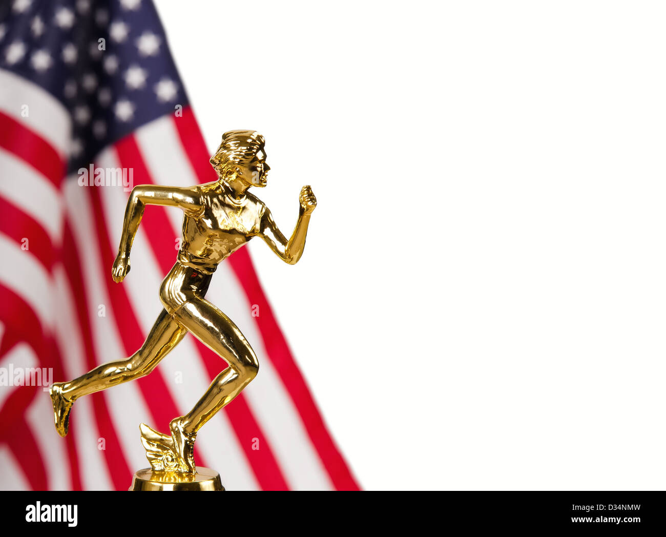 Golden runner trophy with blurred American flag on the background Stock ...