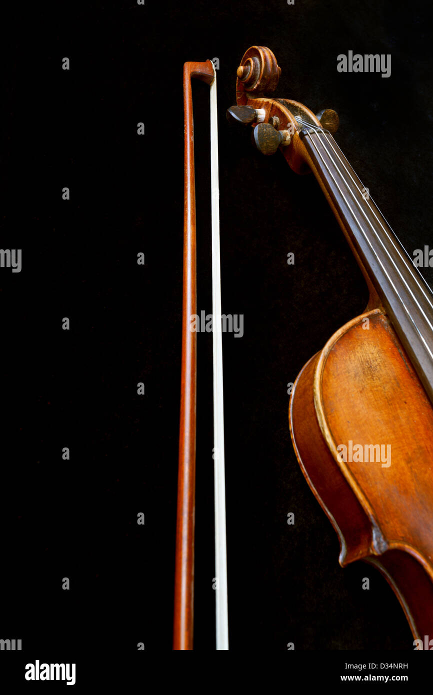 violin neck and bow on black background close up Stock Photo - Alamy