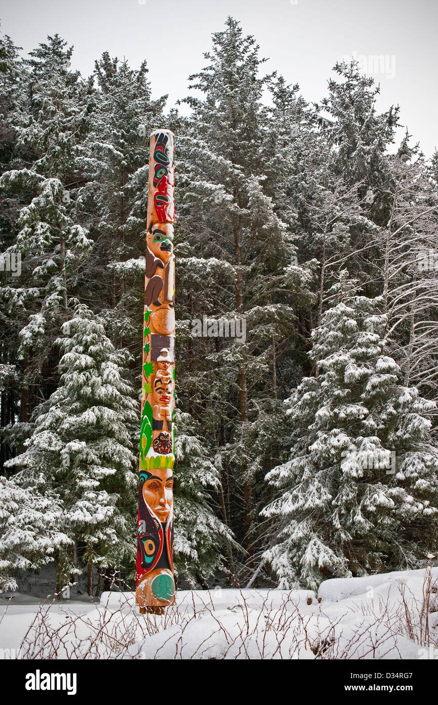 Winter scenic of totem pole in the Sitka National Historical Park ...