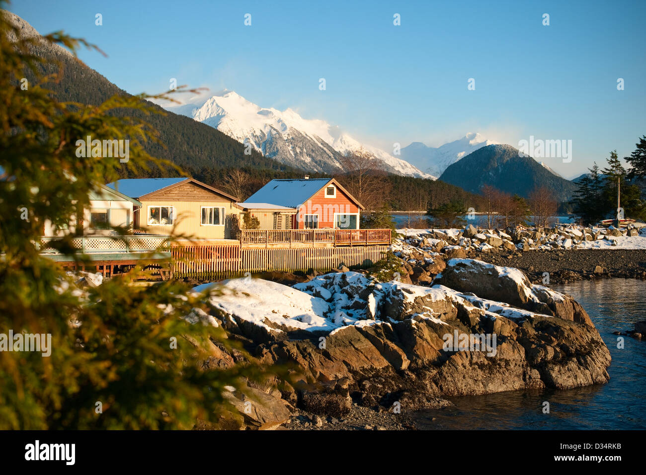 Scenic view of snow capped mountains and downtown Sitka, Alaska on a ...