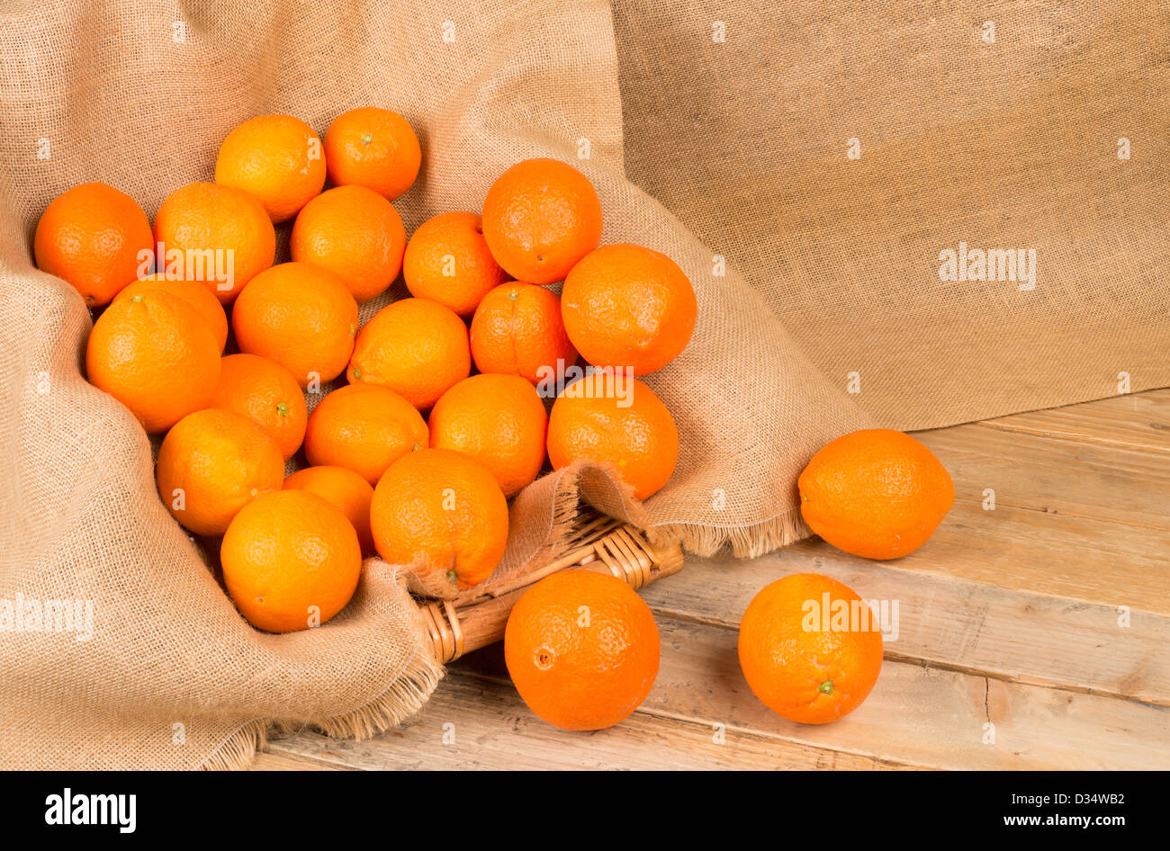 Freshly picked oranges in a rustic still life Stock Photo - Alamy