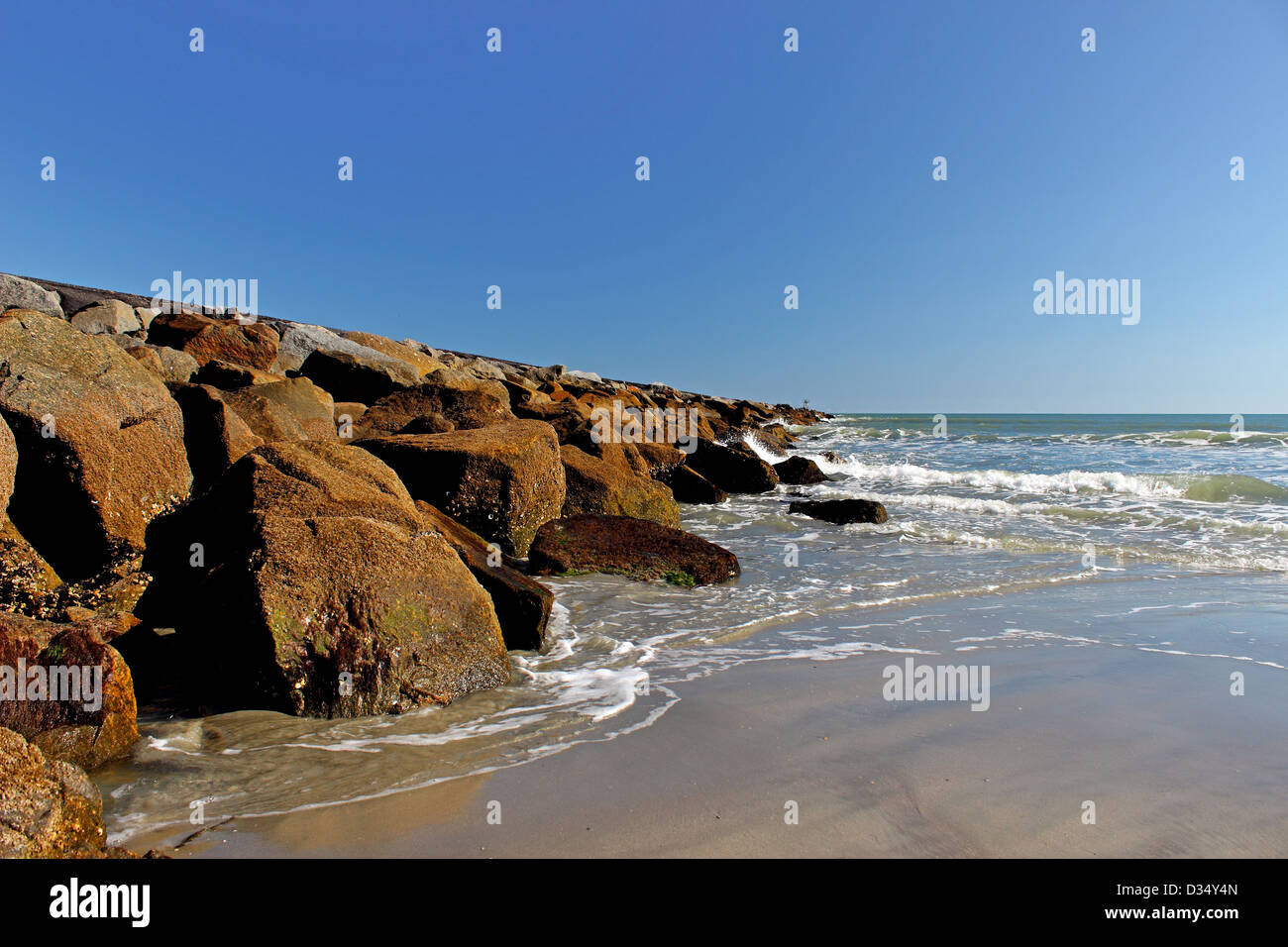 Along rock jetty reaches out into the Atlantic Stock Photo - Alamy