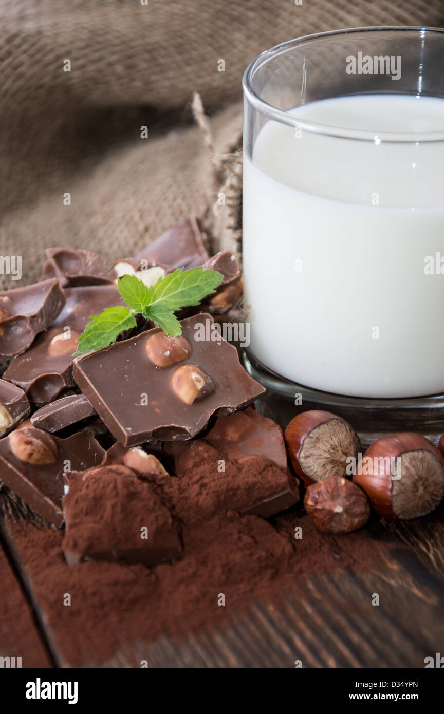 Pieces of dark Hazelnut Chocolate with fresh Milk Stock Photo - Alamy