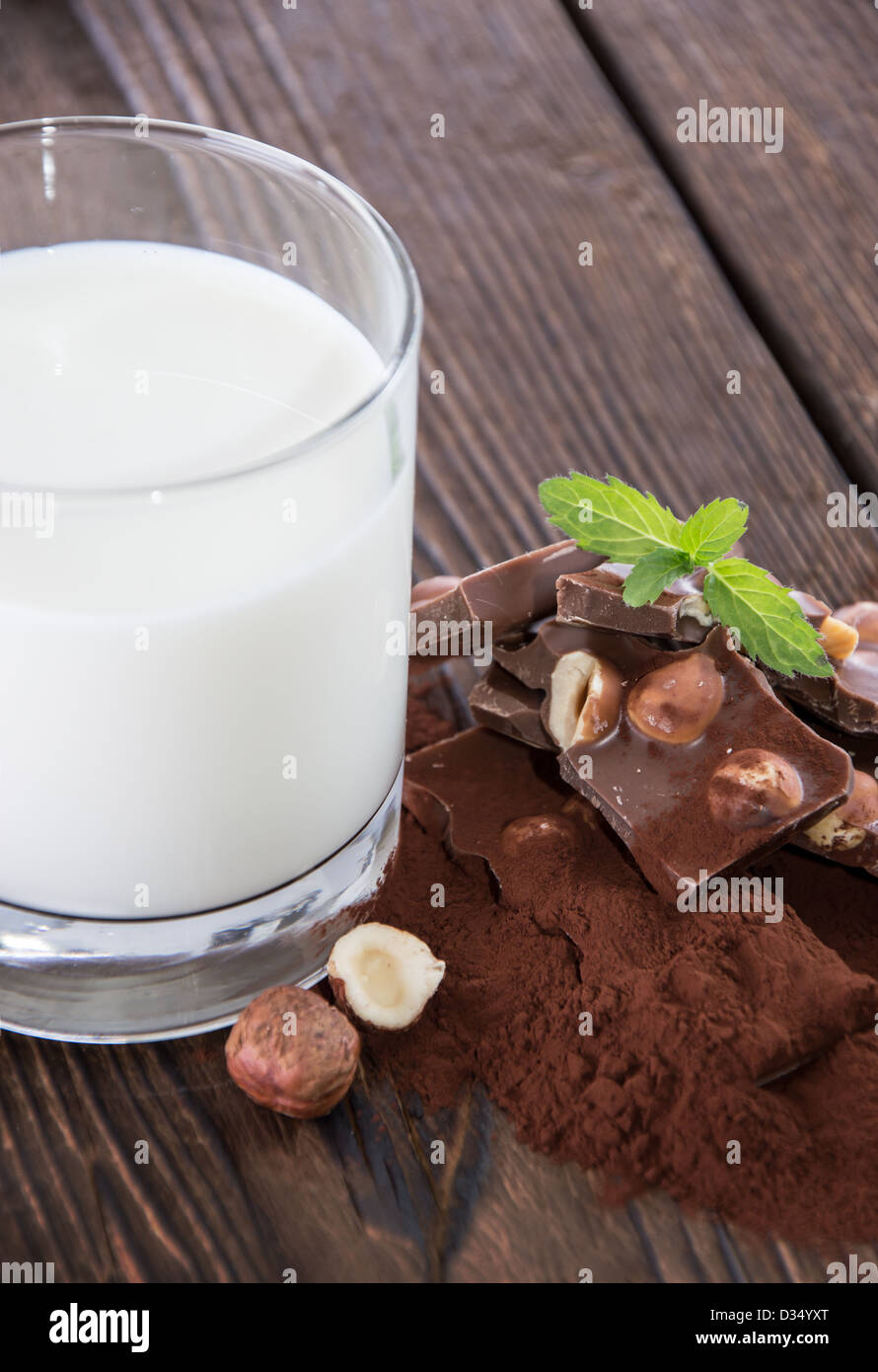 Pieces of dark Hazelnut Chocolate with fresh Milk Stock Photo - Alamy